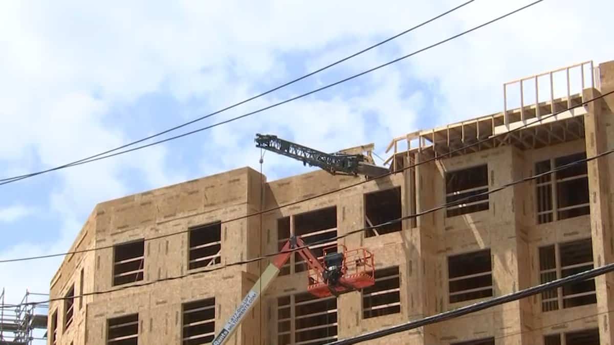 Crane falls on a five-story building under construction in Winchester ...